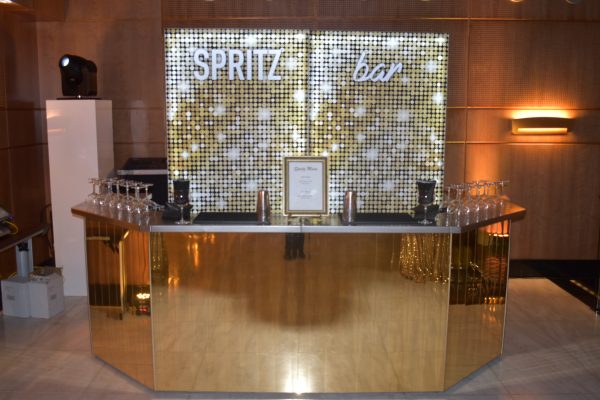 A gold mobile bar and golden event backdrops for this Glitz and Spritz ...